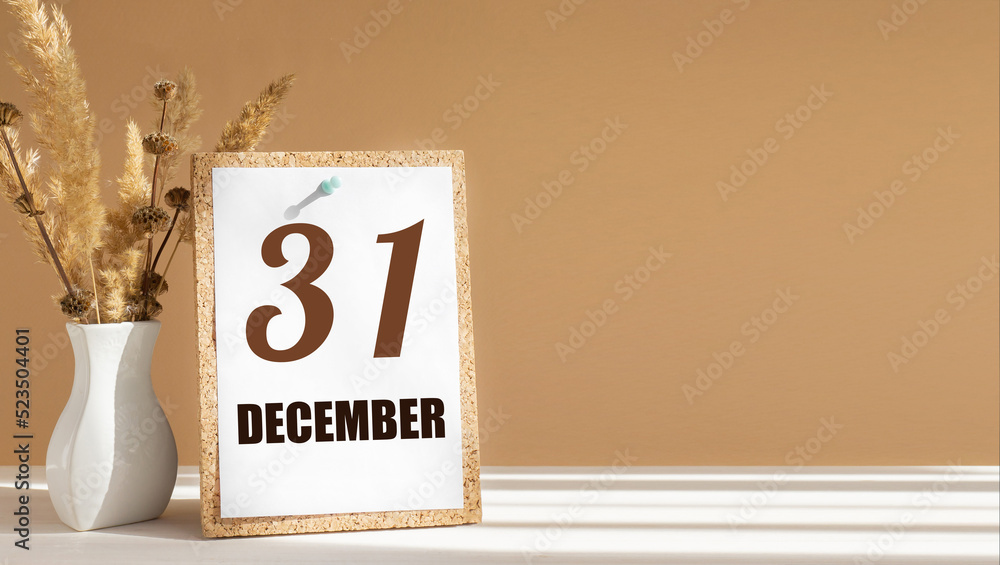 december 31. 31th day of month, calendar date.White vase with dead wood ...