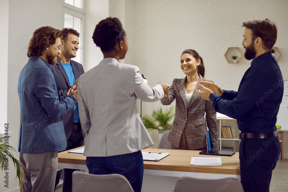 Two teams of diverse people make a successful business deal. Happy ...