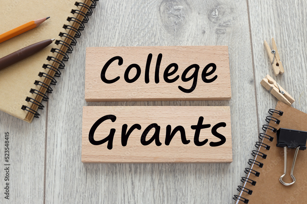 College Grants. wooden blocks with text. wooden background. Presenting ...