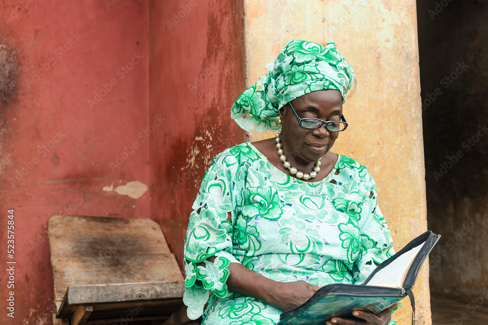 elderly attractive african woman casually dressed in traditional attire ...