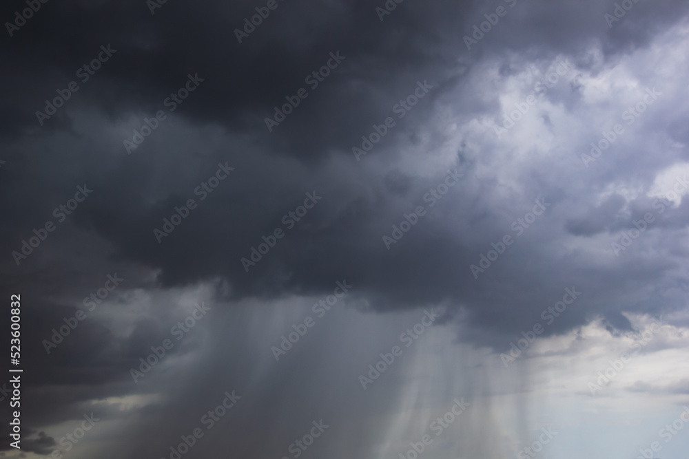 The dark sky with heavy clouds converging and a violent storm before ...