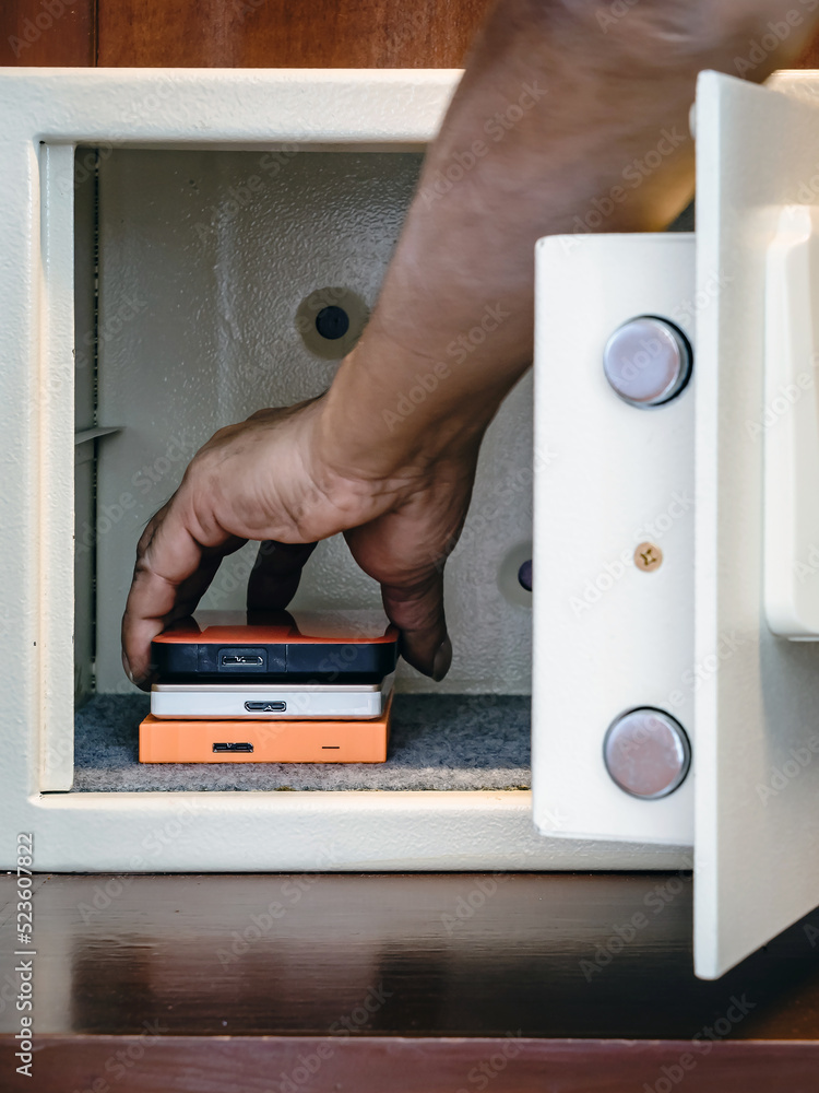 Security external hard drive in open metal safe. External hard disk ...