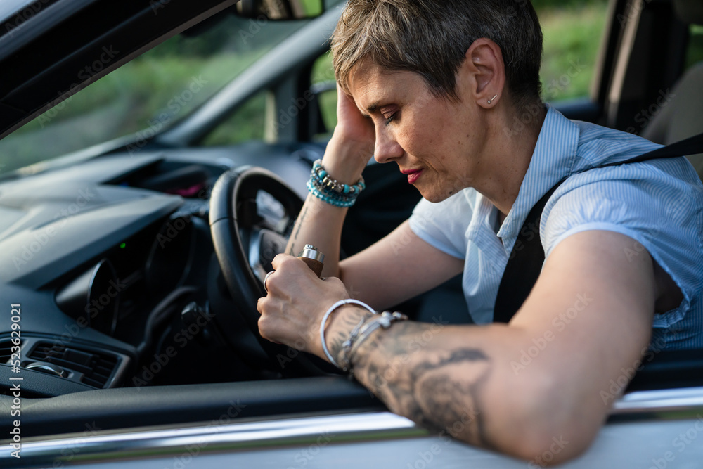woman with flask drink alcohol while driving car drunk female driver ...