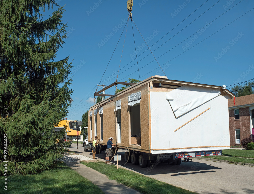Readying Modular Home to be Lifted off Flatbed Stock Photo | Adobe Stock