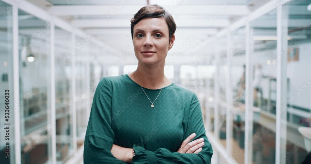 Creative, proud and successful female CEO standing in a modern work ...