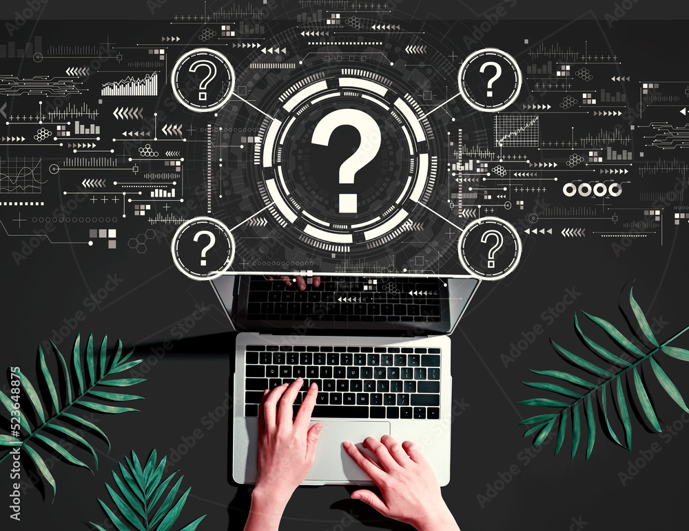 Question marks with person using a laptop computer Stock Photo | Adobe ...