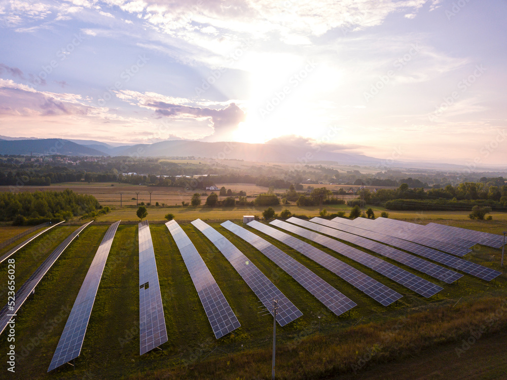 Solar farm system on a field. Green energy renewable resources climate ...