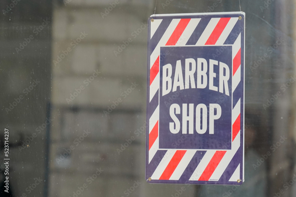 barber shop text sign in wall facade entrance hairdresser in windows ...