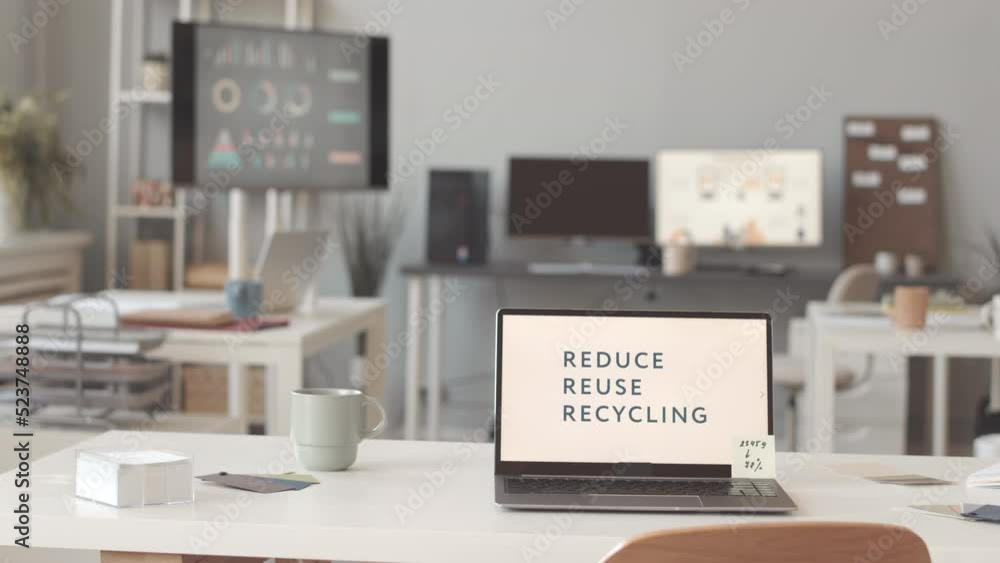 No people slowmo of laptop with Reduce Reuse Recycling lettering on ...