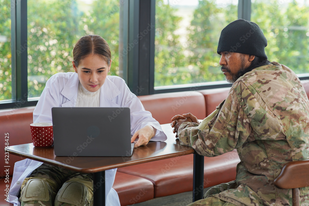 Doctor meet with army soildier in military hospital office interview ...