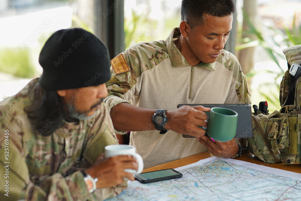 Army ranger military special force hold a cup drink coffee discussion ...