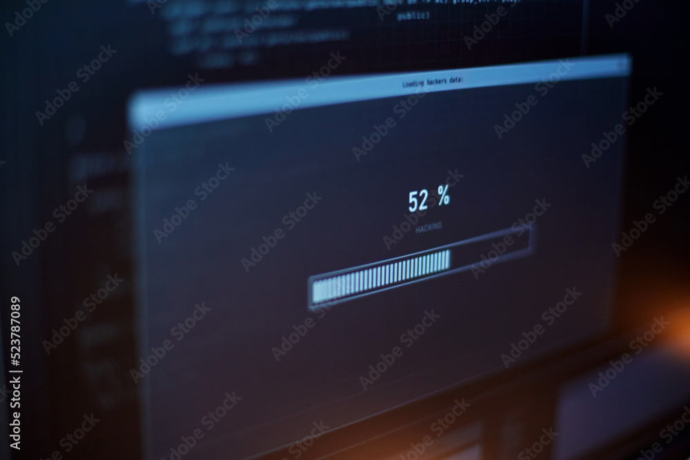 Cybercrime Hacking And Technology Concept Close Up Of Computer Monitor With Progress Loading