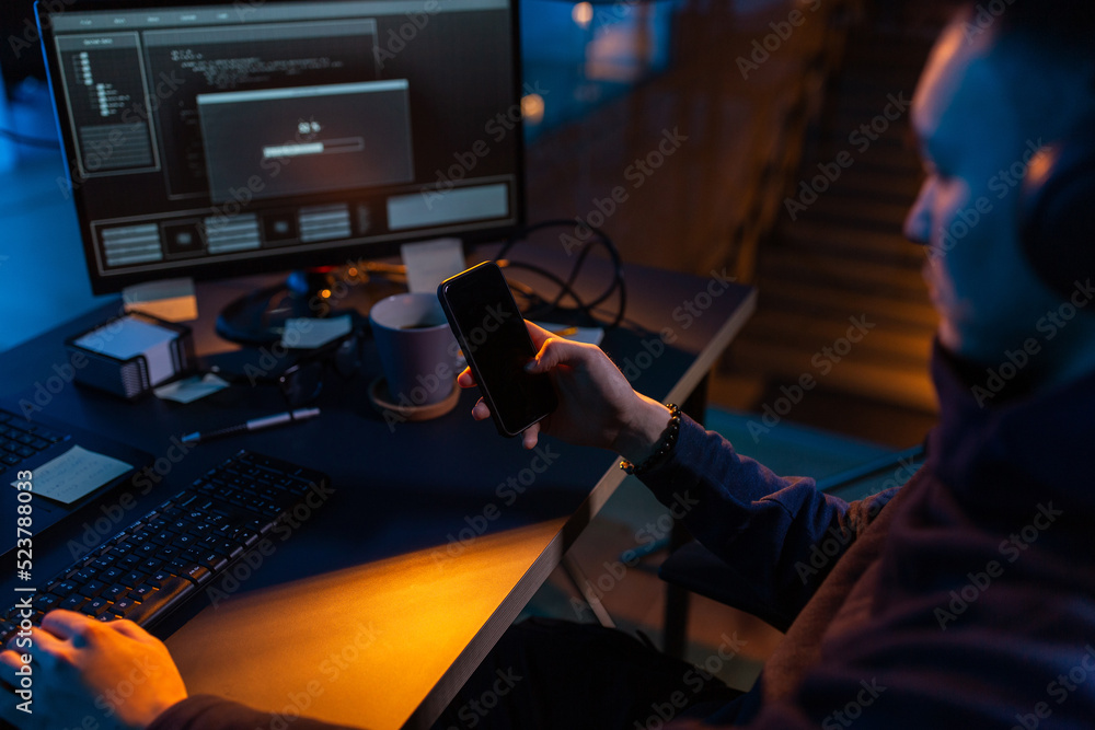 cybercrime, hacking and technology concept - close up of male hacker ...