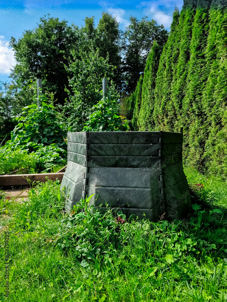 compost boxe made from planks in the garden. Save the planet concept ...