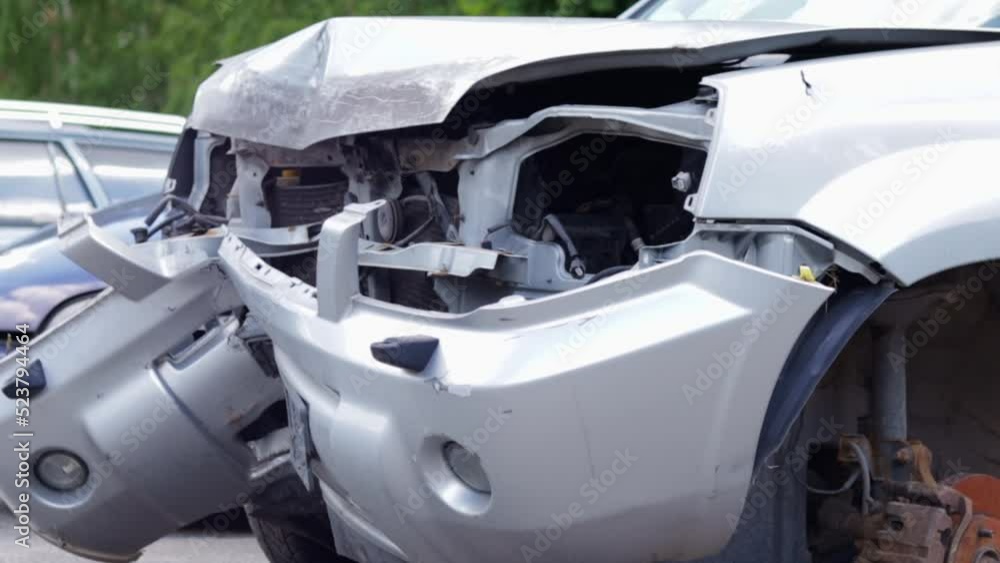 Broken headlights as a result of a collision. Broken gray car after an ...