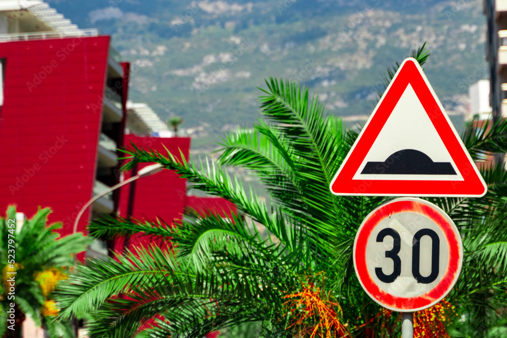 two red signs triangular and round informing about approaching a ...