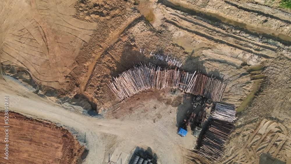 Large stack of felled trees stacked on top of each other, aerial view ...