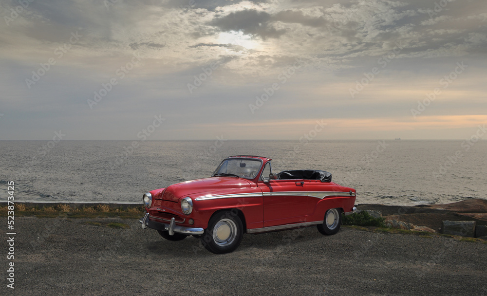 Carro antigo vermelho descapotavel da marca Simca parado à beira mar ...