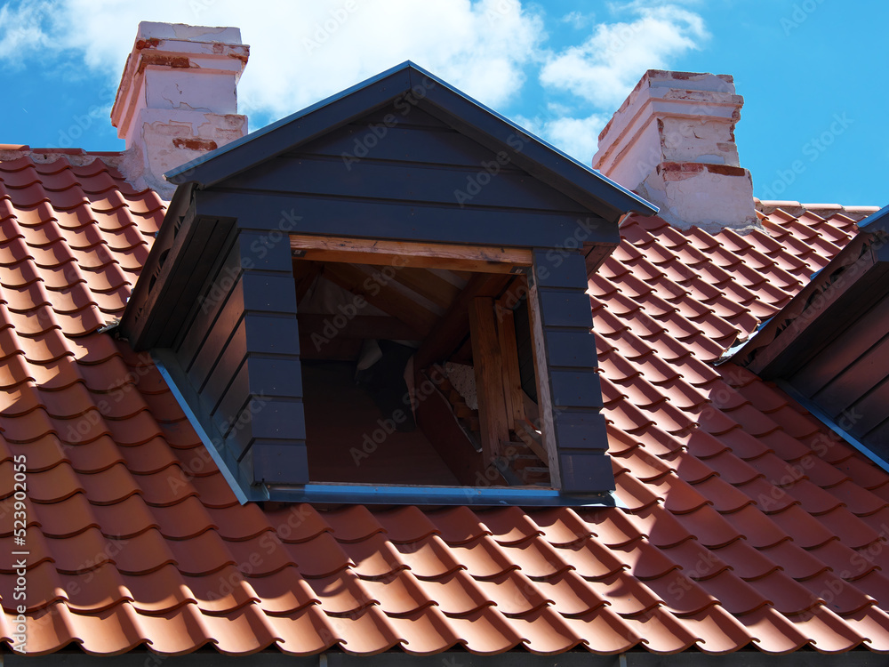 New roof construction in residential building. Dormer windows. Stock ...