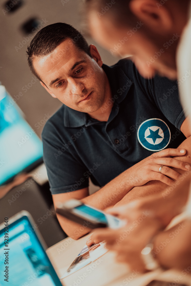Foto Stock Male security operator working in a data system control room ...