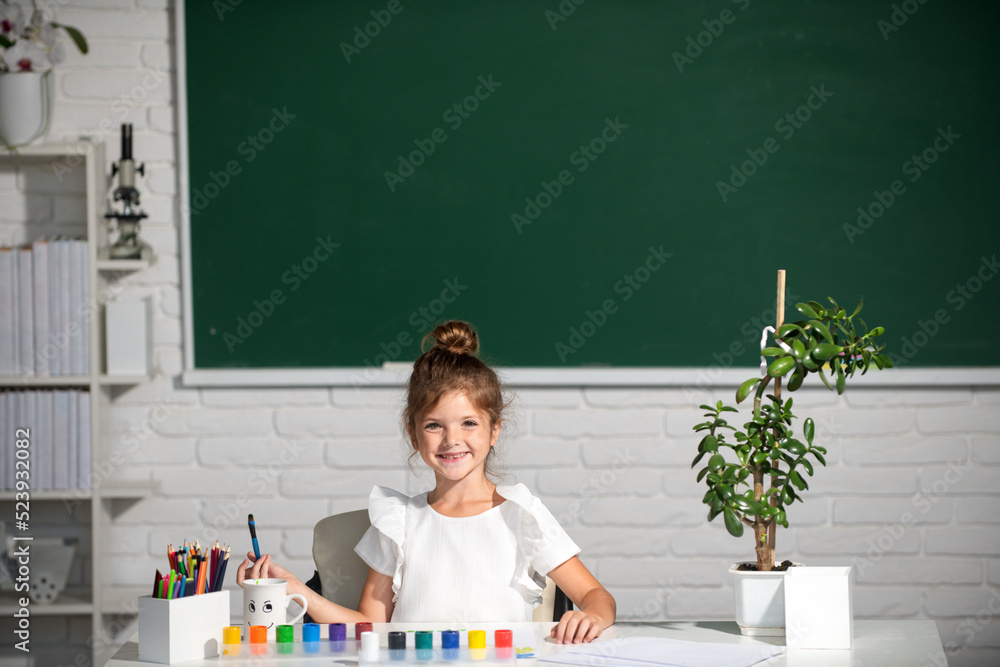 Child girl drawing with coloring pens paintind. Portrait of adorable ...