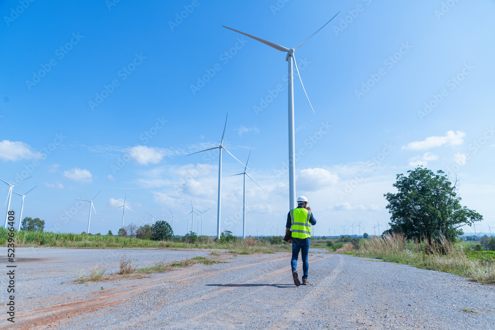 Engineer wearing uniform ,helmet inspection and survey work in wind ...