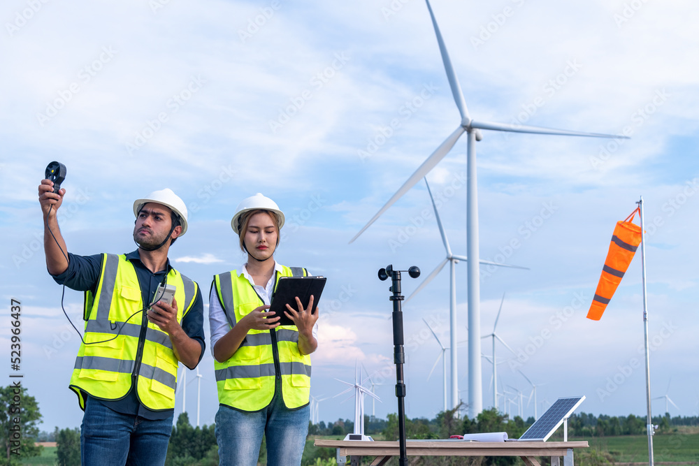 Engineer wearing uniform ,helmet inspection and survey work in wind ...