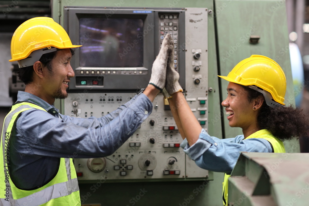 Happy smiling teamwork technician engineer or worker in protective ...