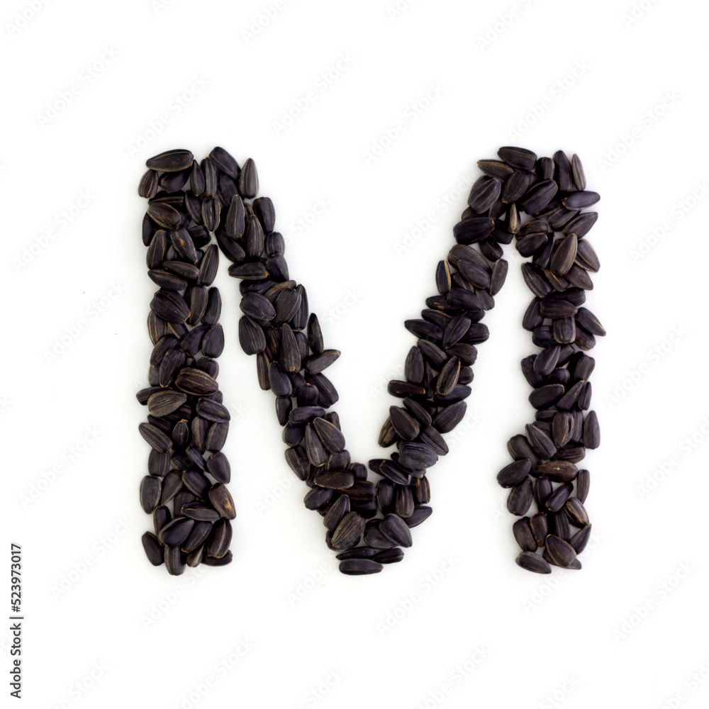Capital letter M made from sunflower seeds. Alphabet made from ...