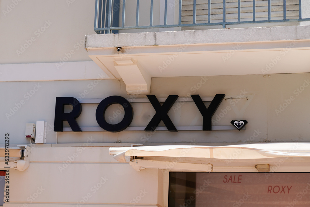 roxy logo text and sign wall of surf brand exterior facade shop ...