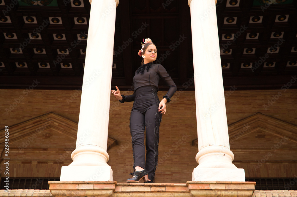 Beautiful teenage flamenco dancer with brown hair and dressed in dance ...
