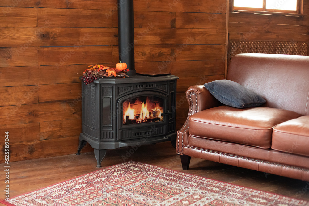 Black modern Cast iron wood stove at home. Fragment of interior of ...