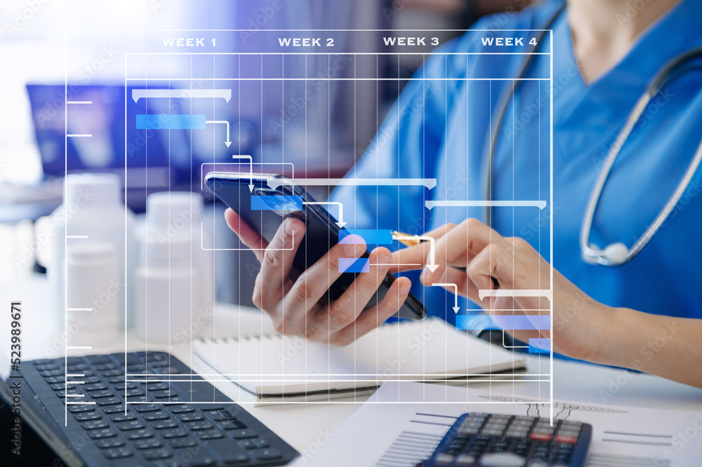 Project manager working and update tasks with Gantt chart scheduling ...