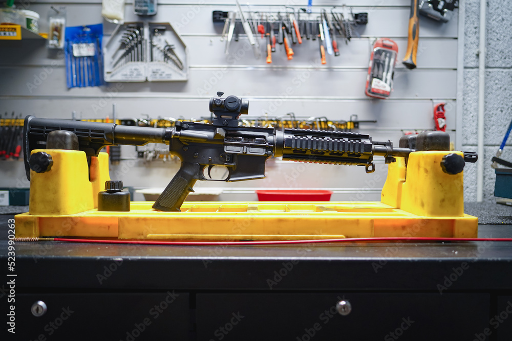 Repair and maintenance of weapons in the workshop. gunsmithing. Stock ...