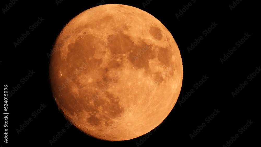 Extreme zoom photo of illuminated radish full moon as seen in August ...