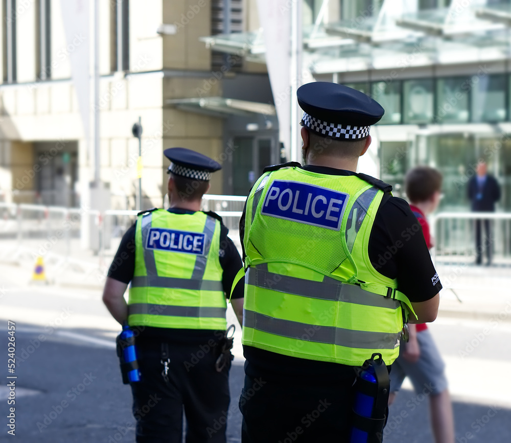 Police officer on duty on a city centre street during special event ...