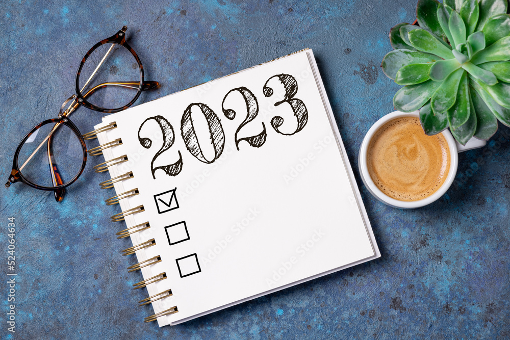 New year resolutions 2023 on desk. 2023 resolutions list with notebook ... New year resolutions 2023 on desk. 2023 resolutions list with notebook ...