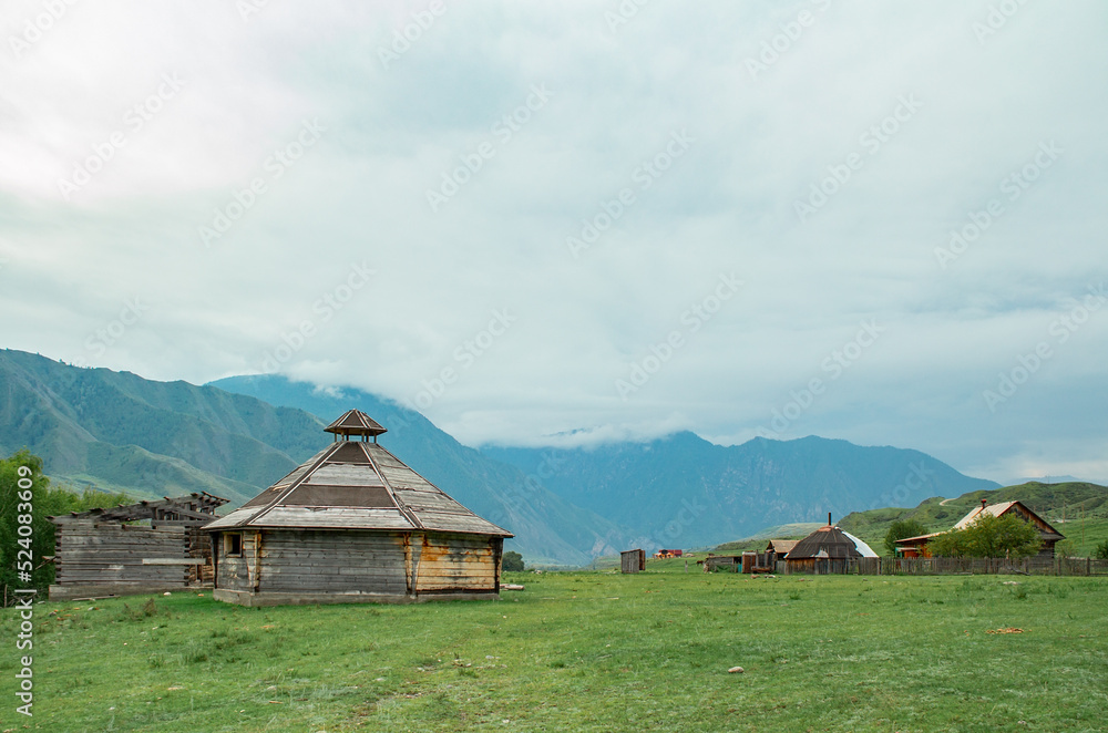 high altitude morning landscape with wooden village houses and an ...