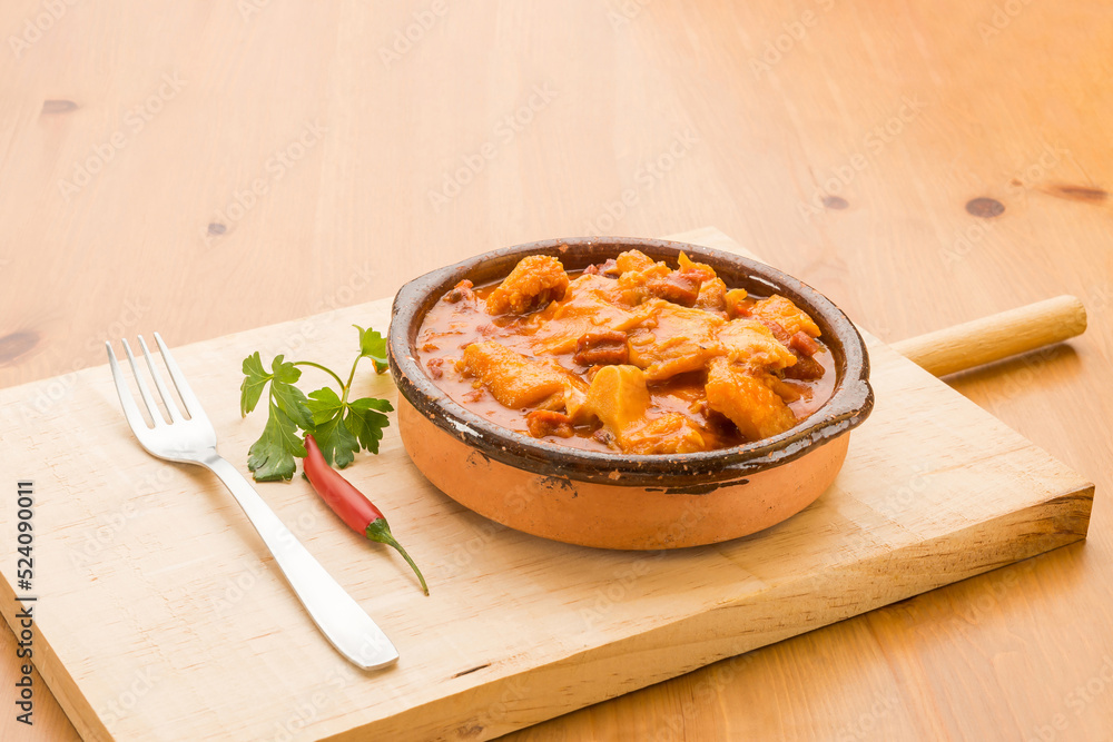 Callos a la madrilena stewed in a clay pot, typical Spanish food. Stock ...