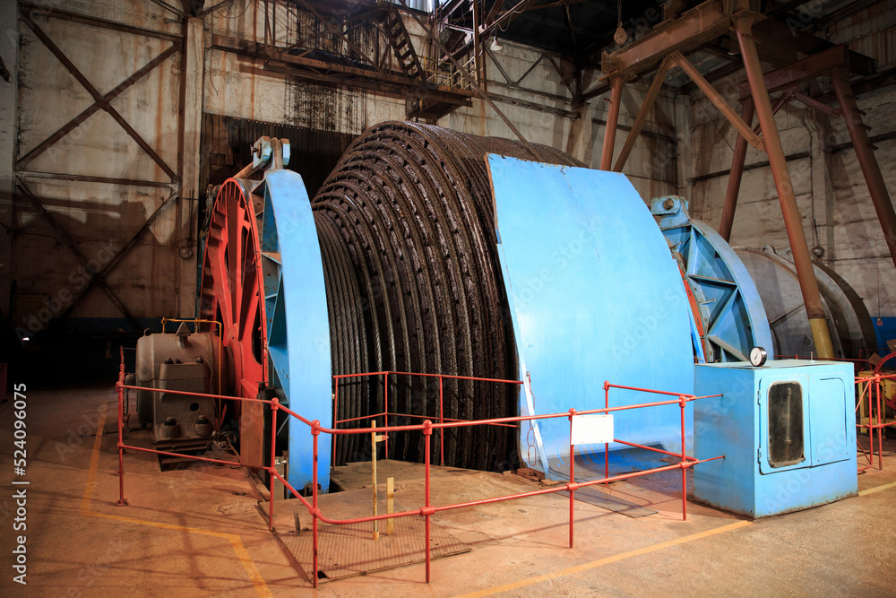 The aggregate of a shaft hoisting machine. A cable for lifting loads in ...