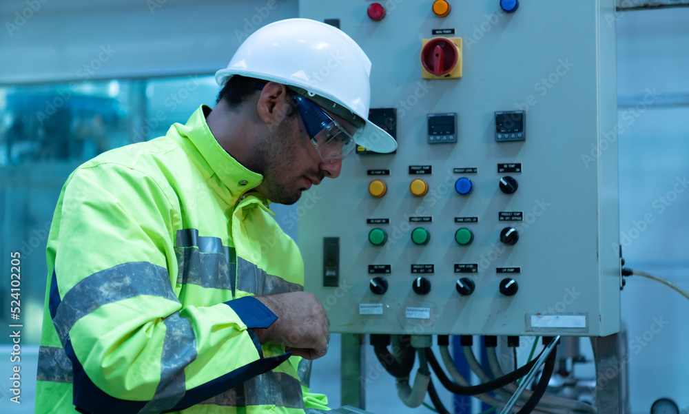 Chief Engineer of Mechanical Plant Checking the electronic circuit of ...