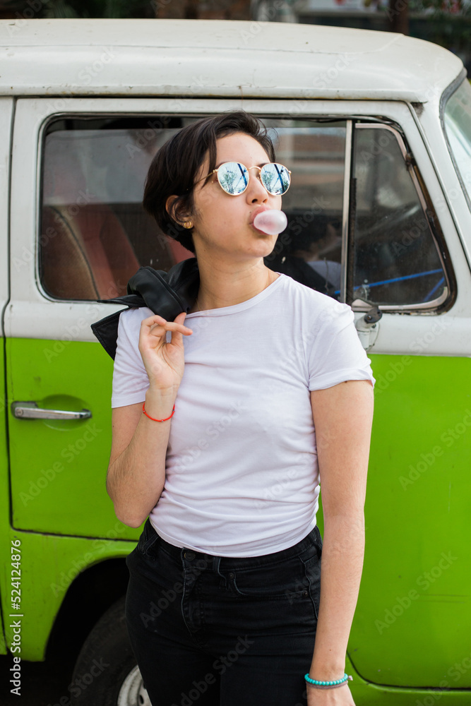 young greaser girl with short hair, posing with a fifties rockabilly ...