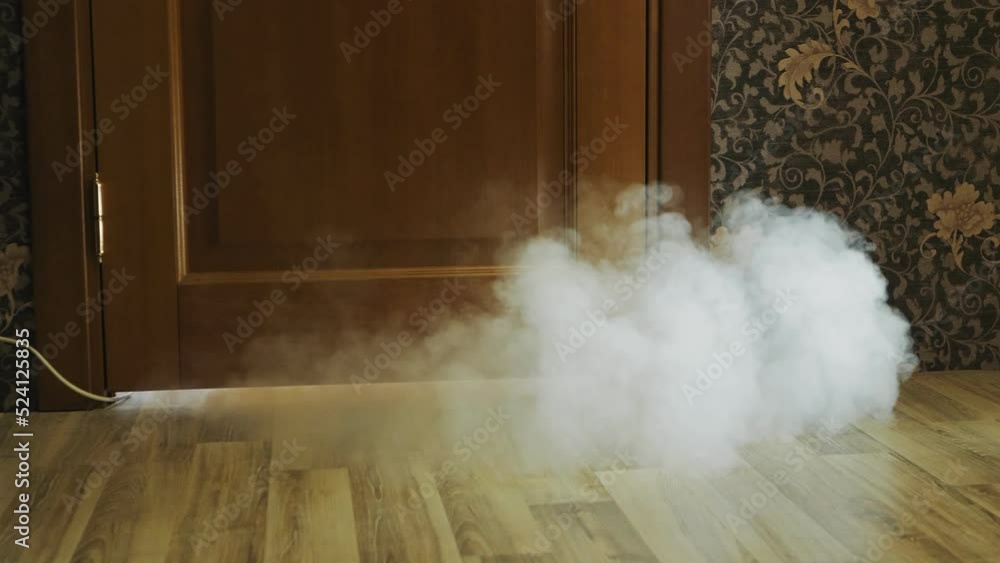 Dark smoke is coming from under the closed door into the rooms below ...