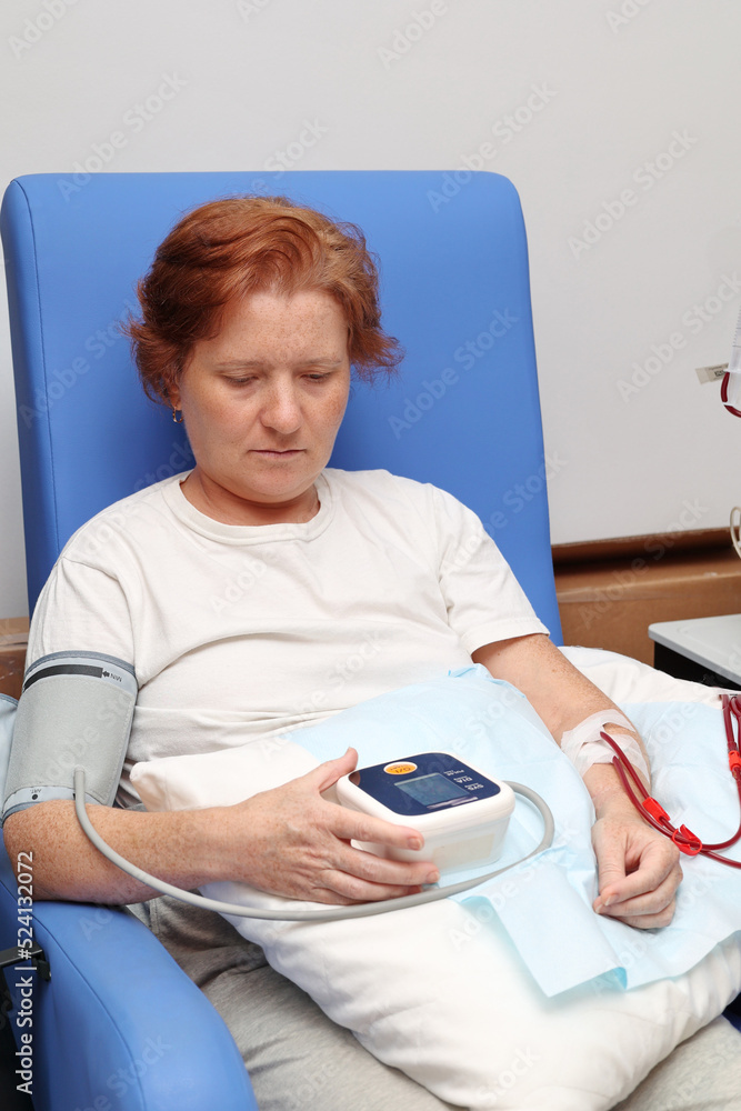 White middle age woman with kidney failure prepares for dialysis at ...