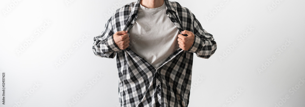 strong person breaks his shirt and opens shirt as a super hero ...