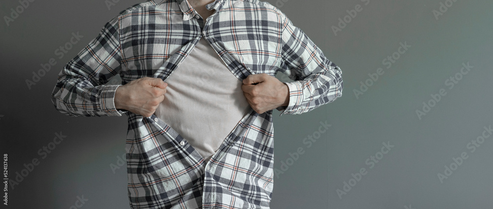 strong person breaks his shirt and opens shirt as a super hero ...