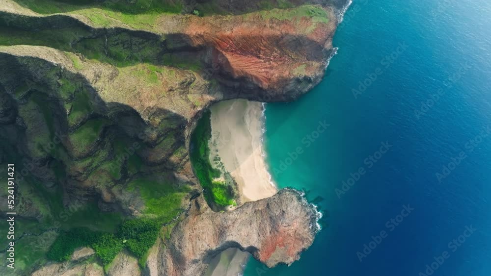 Epic aerial of Na Pali coast secret Beach, world famous incredible ...