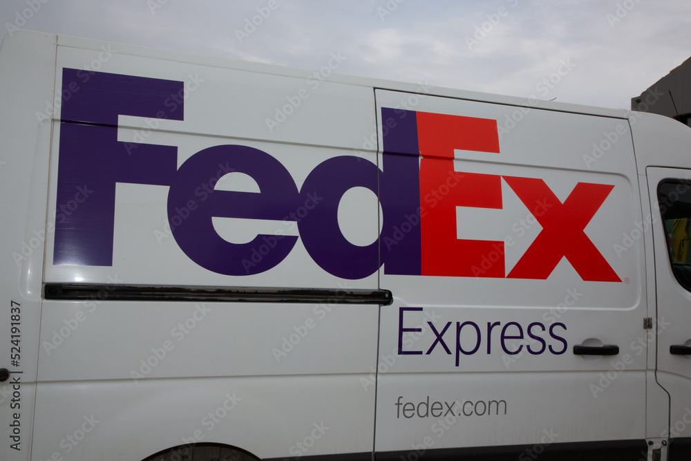 fedex express logo brand and text sign delivery panel van truck in city ...