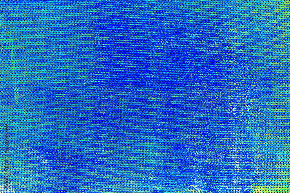 Building under construction wrapped blue protection safety net. Changed ...