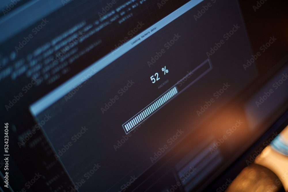 Cybercrime Hacking And Technology Concept Close Up Of Computer Monitor With Progress Loading